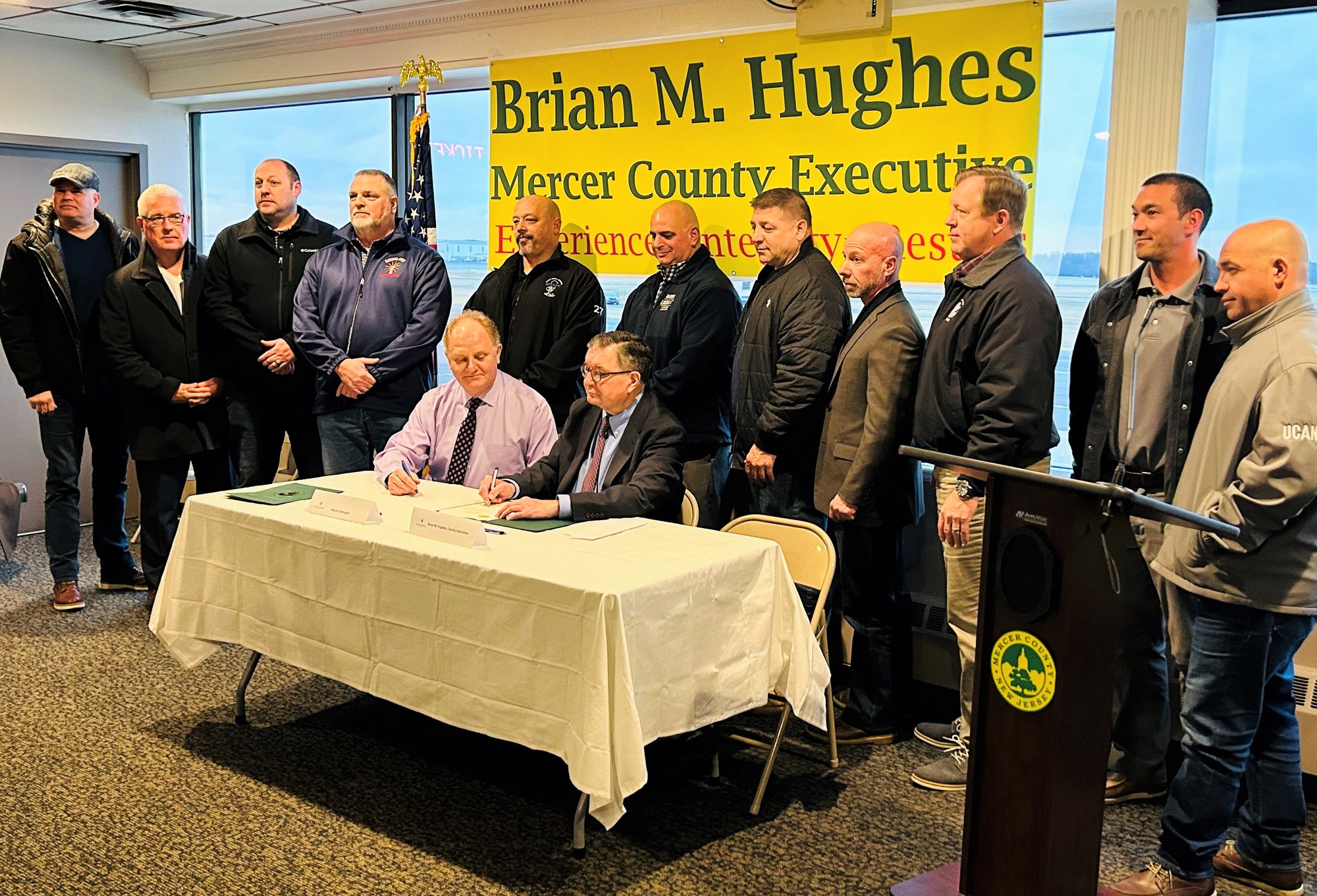 Hughes, DeAngelo sign labor agreement for airport project